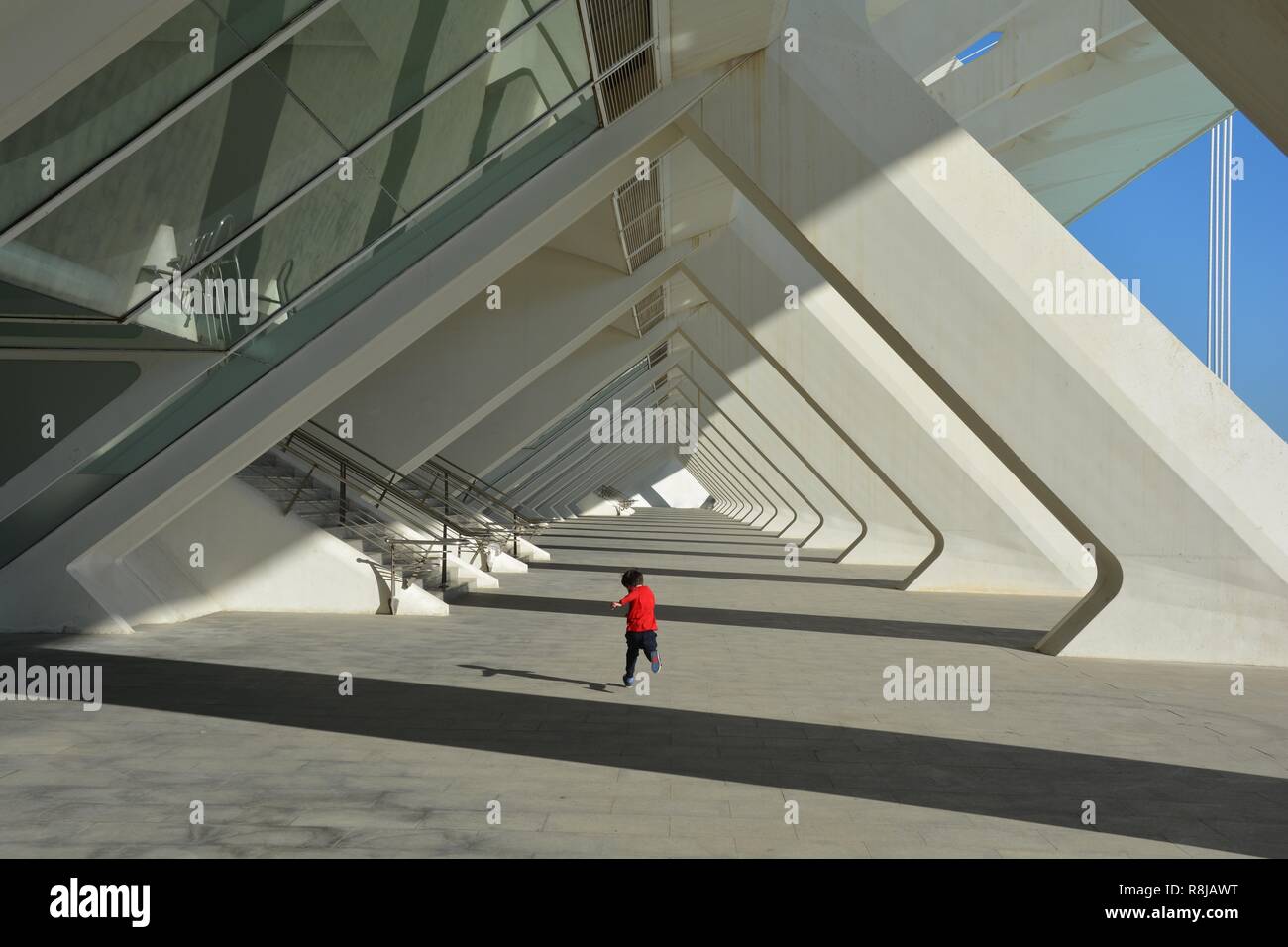 boy running in a modern building, architecture Stock Photo - Alamy