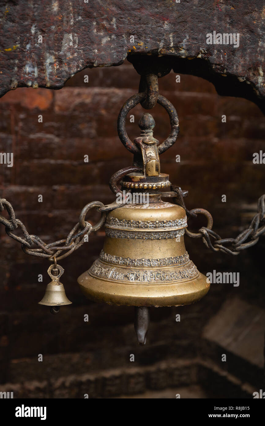 Brass bell hanging at a temple in Kathmandu, Nepal Stock Photo - Alamy
