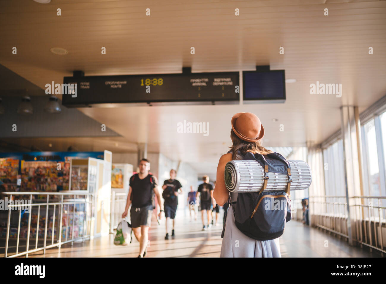 Theme travel public transport. young woman standing with back in dress ...