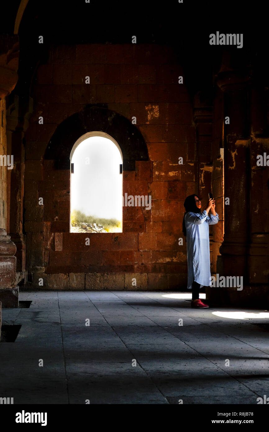 Arabic woman taking a picture inside a temple Stock Photo - Alamy