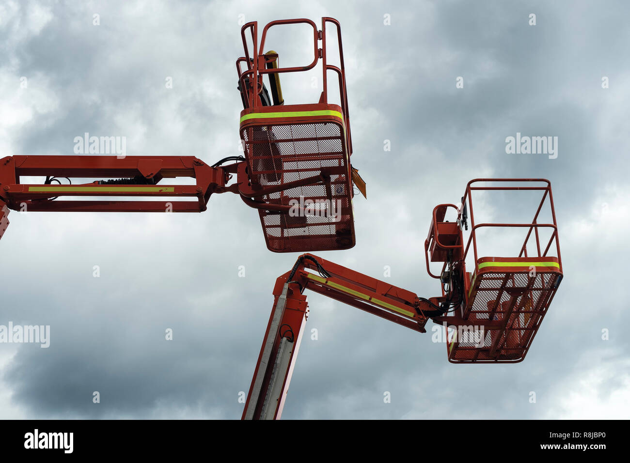 Two cherry pickers Stock Photo - Alamy