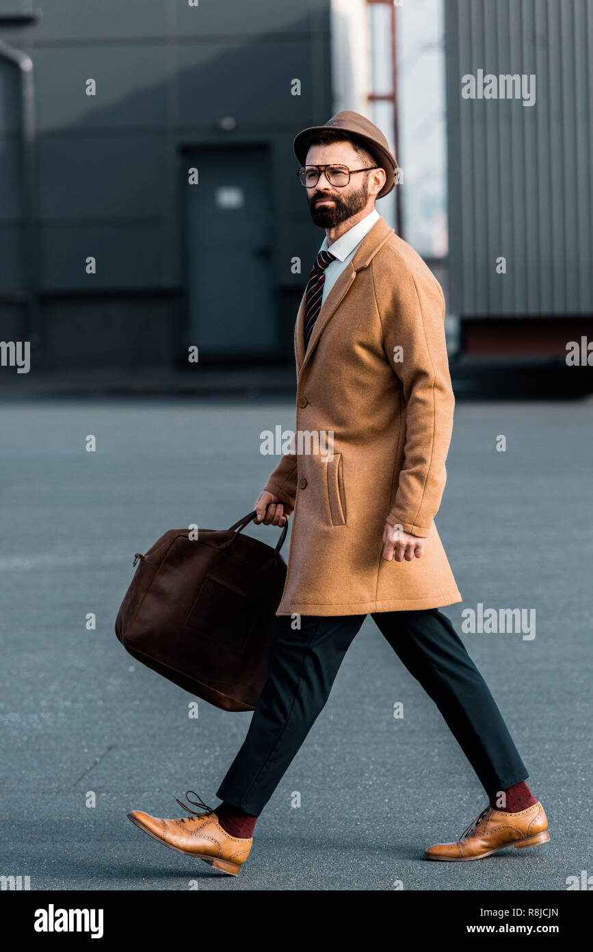 Handsome businessman bag walking hi-res stock photography and images ...