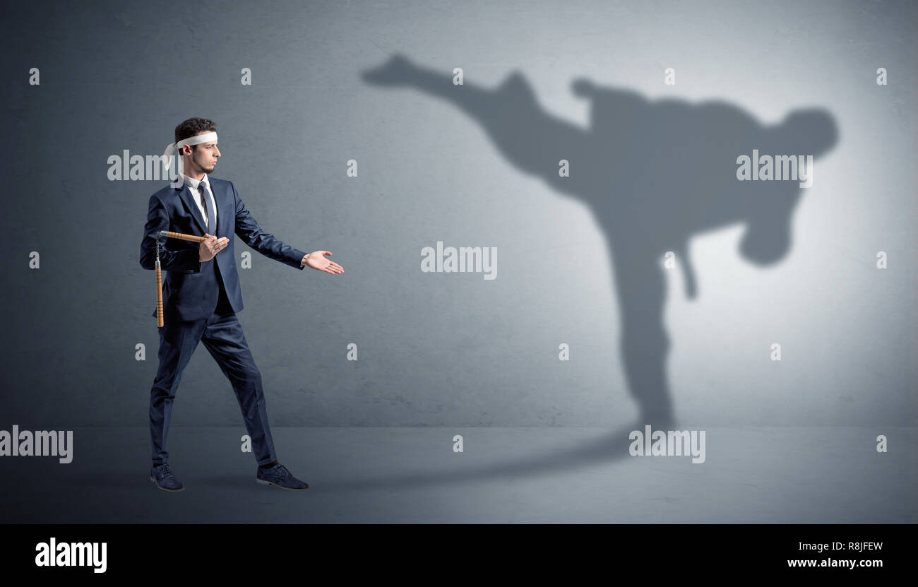 Young karate man confronting with his own shadow Stock Photo - Alamy