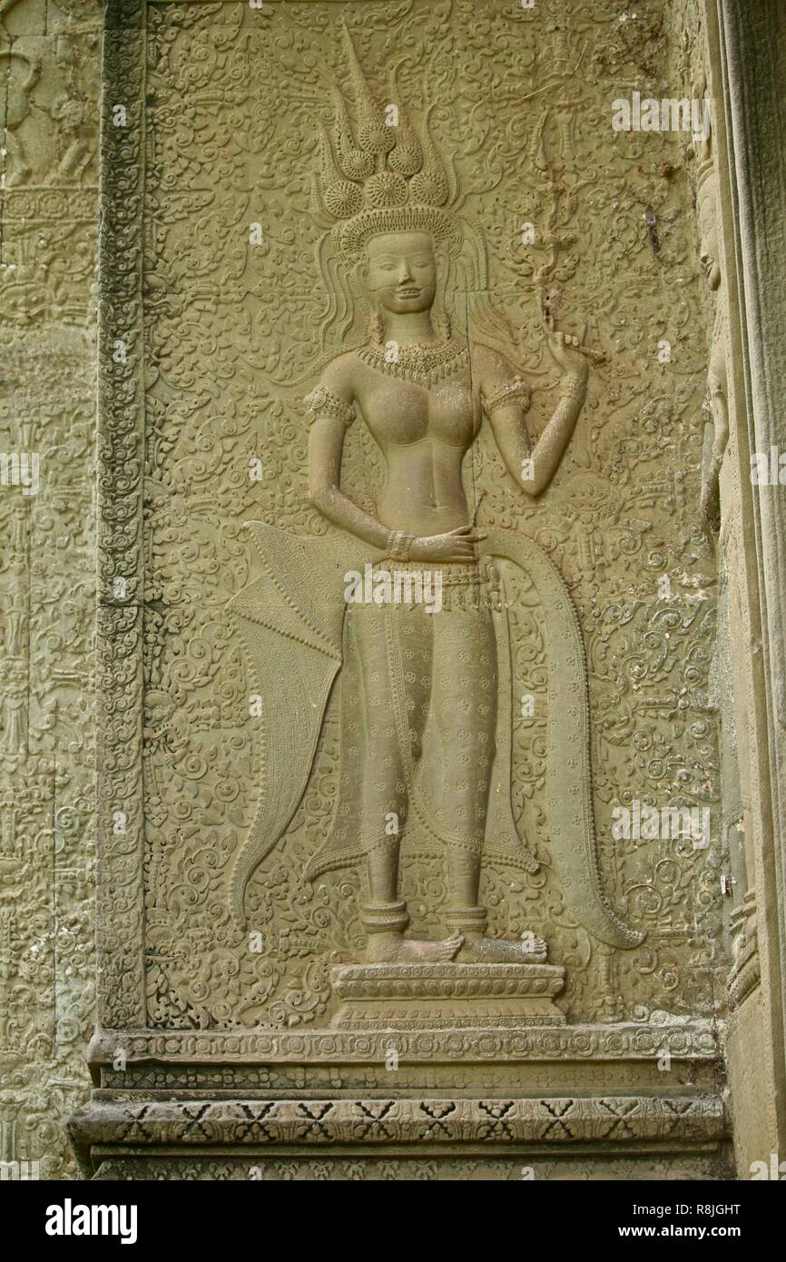 A dancing girl carved into a stone temple wall in Angkor Wat, Cambodia ...