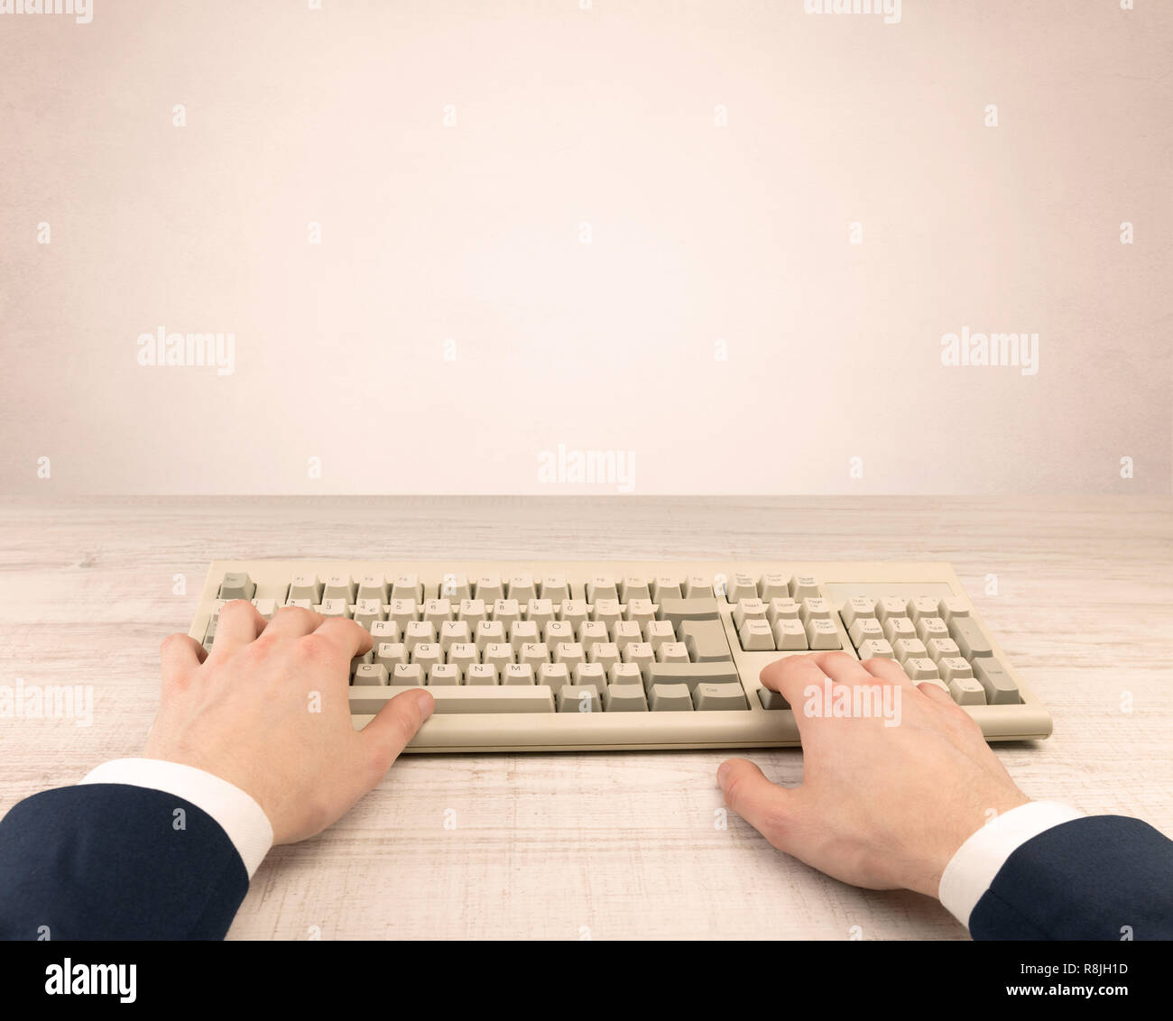 First person view of an elegant businessman hand typing on light ...