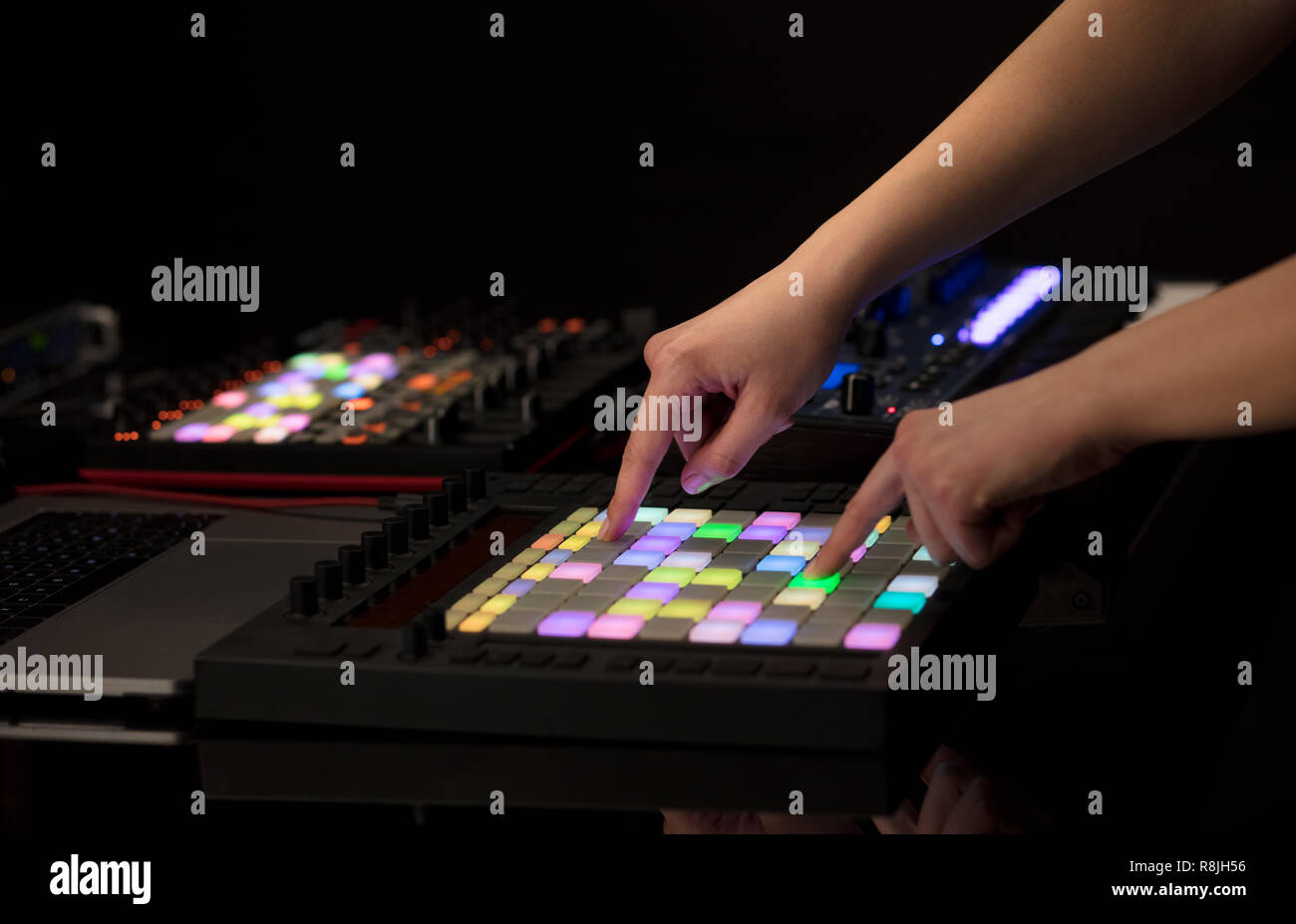 Dj hand remixing music on midi controller Stock Photo - Alamy