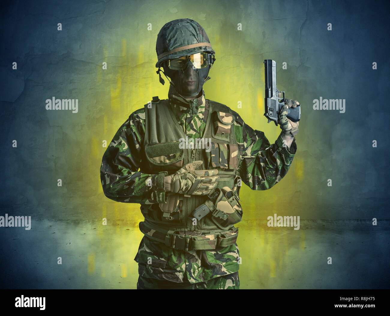 Hazard, menace soldier in a ruined crumbly building with arms on his ...