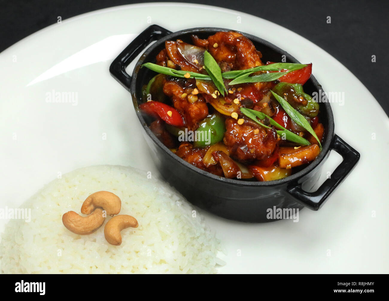 Chinese chili chicken with white rice Stock Photo - Alamy