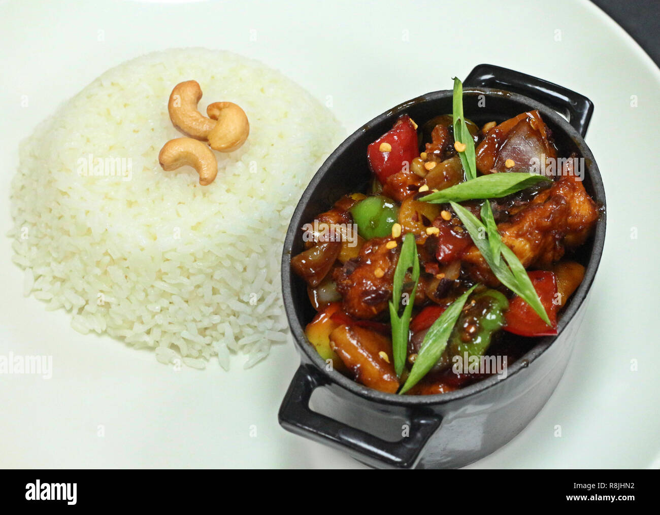 Chinese chili chicken with white rice Stock Photo - Alamy