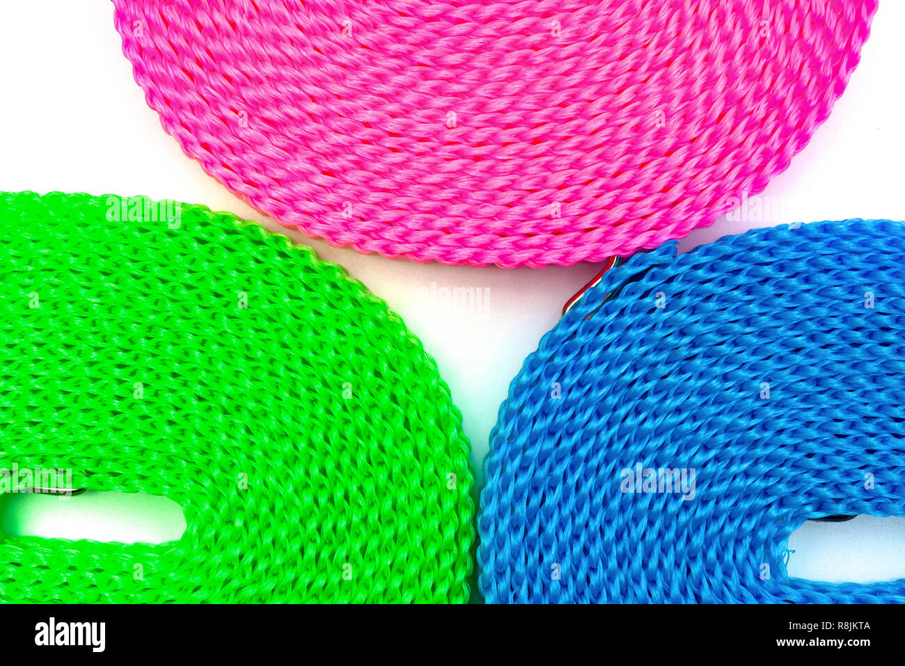 top view blue red and green plastic clotheslines close up on white ...