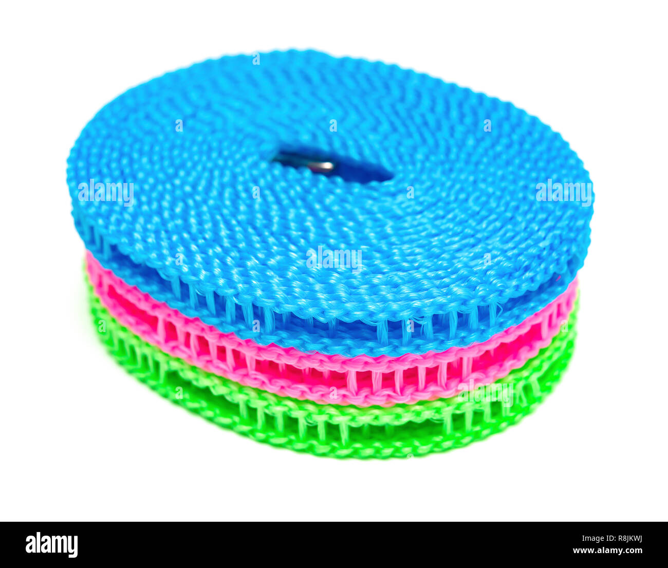 blue red and green plastic clotheslines stacked up on white Stock Photo ...