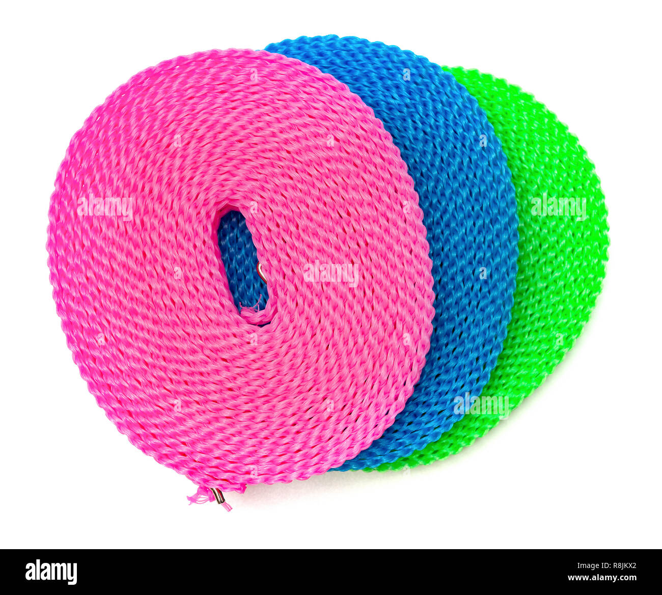 blue red and green plastic clotheslines stacked up on white Stock Photo ...