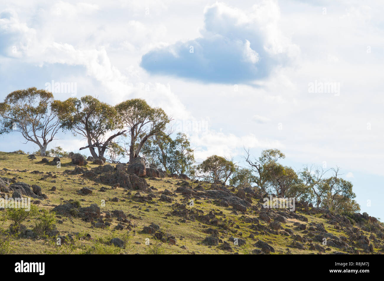 Rocky australian countryside on an overcast day as the sun starts ...