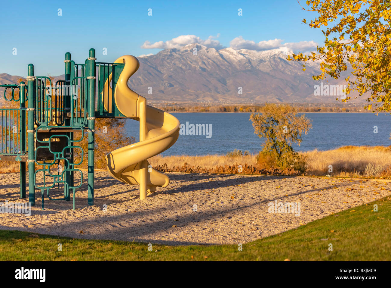 Playground slide mountains view Utah Lake behind Stock Photo - Alamy
