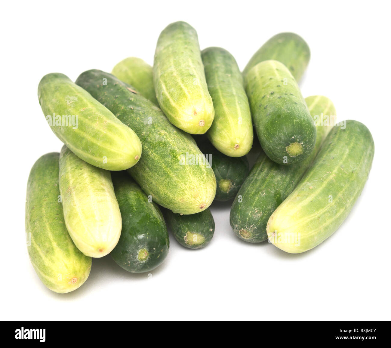 Pile of cucumbers isolated on white background Stock Photo - Alamy