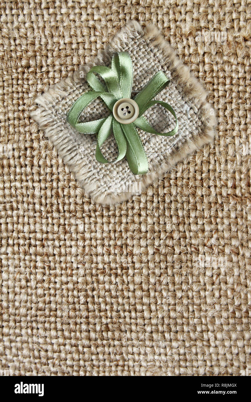 Background with fabric texture and button Stock Photo - Alamy