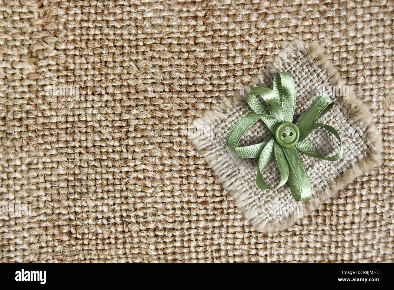 Background with fabric texture and button Stock Photo - Alamy