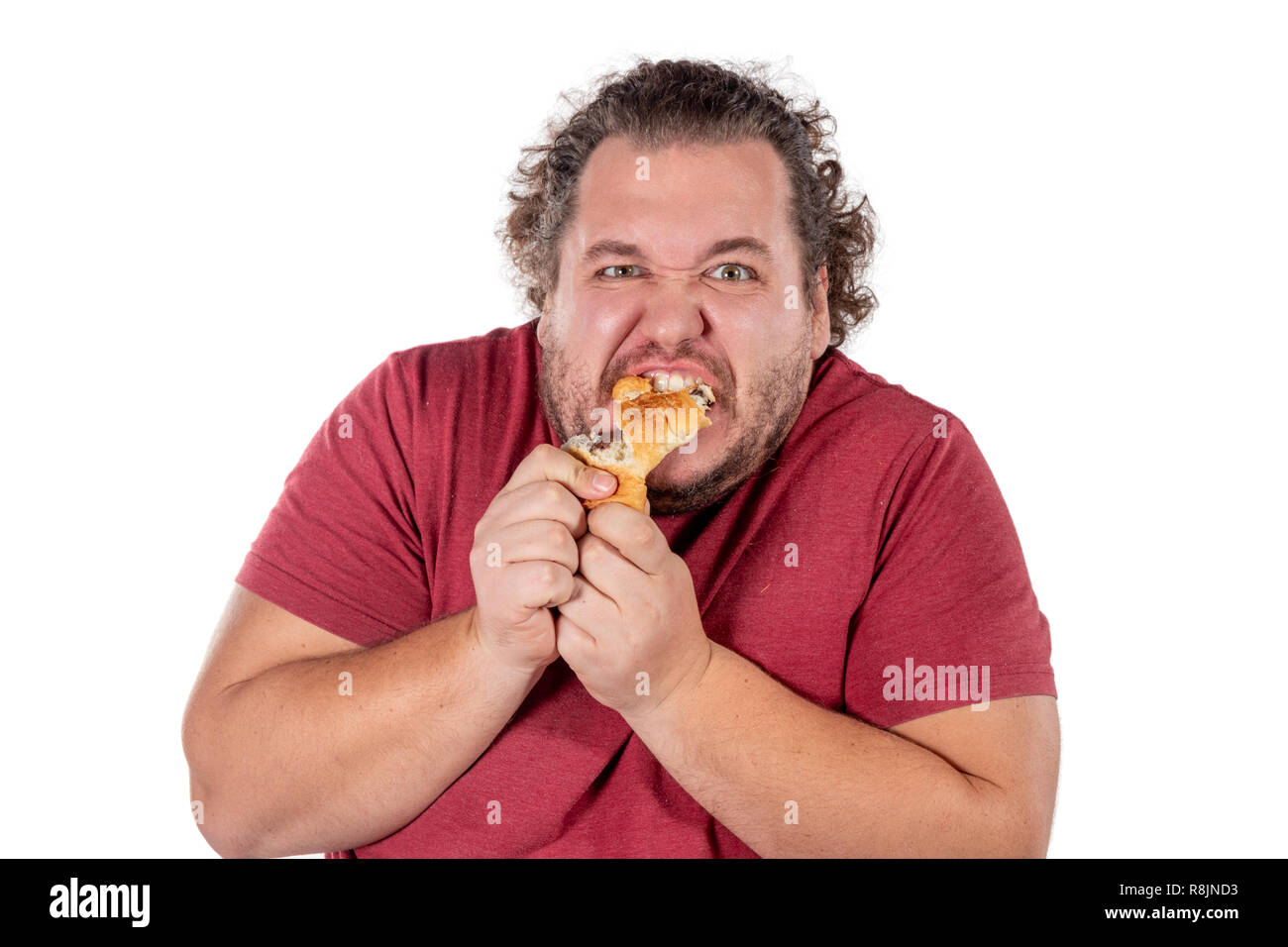 Funny fat man eating croissant Stock Photo - Alamy