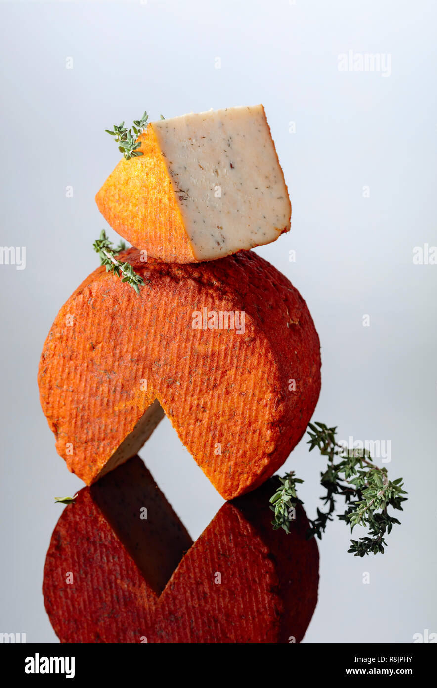 Red Pecorino sheep milk cheese with thyme and pepper. Traditional sheep ...