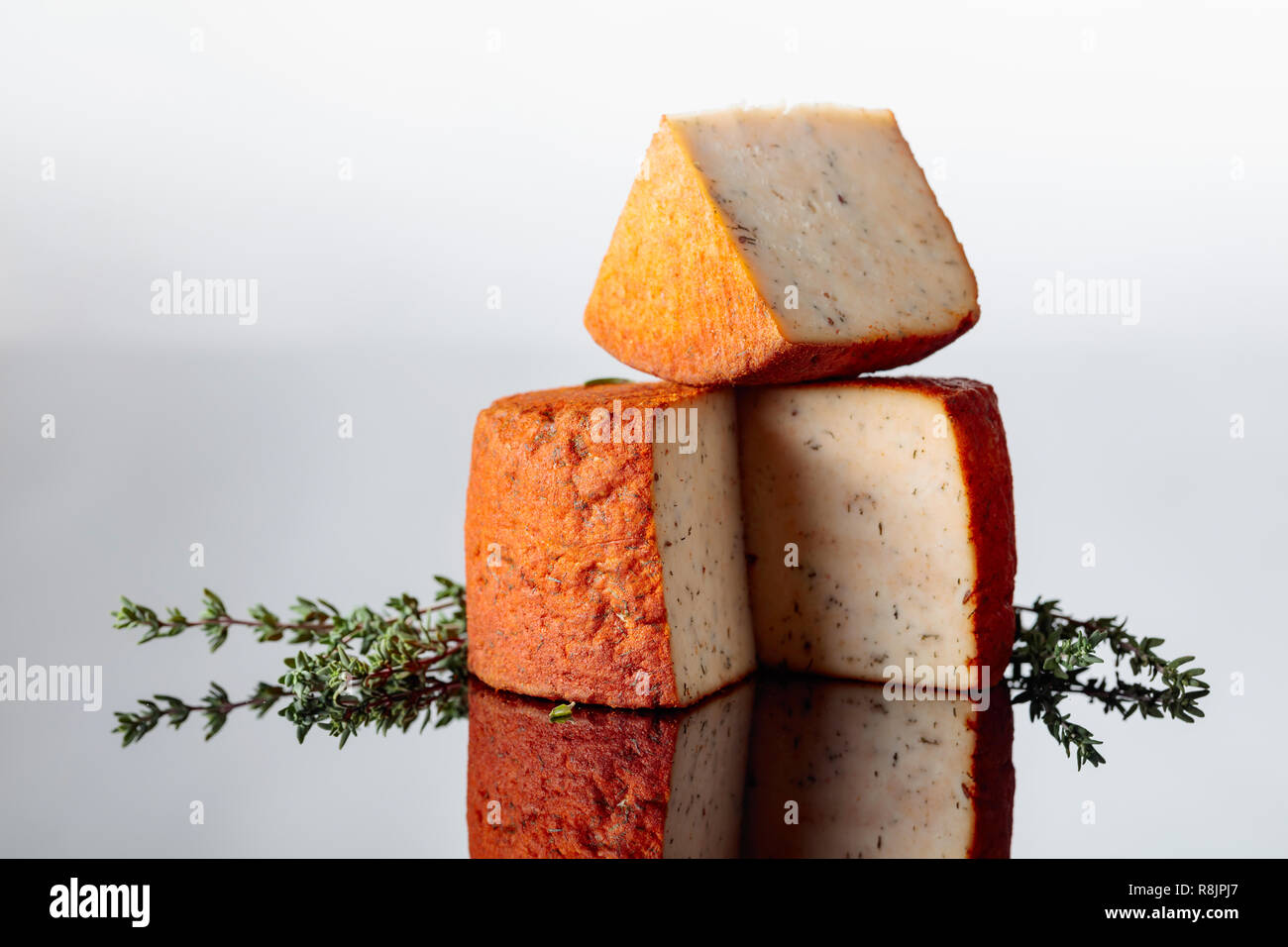 Red Pecorino sheep milk cheese with thyme and pepper. Traditional sheep ...