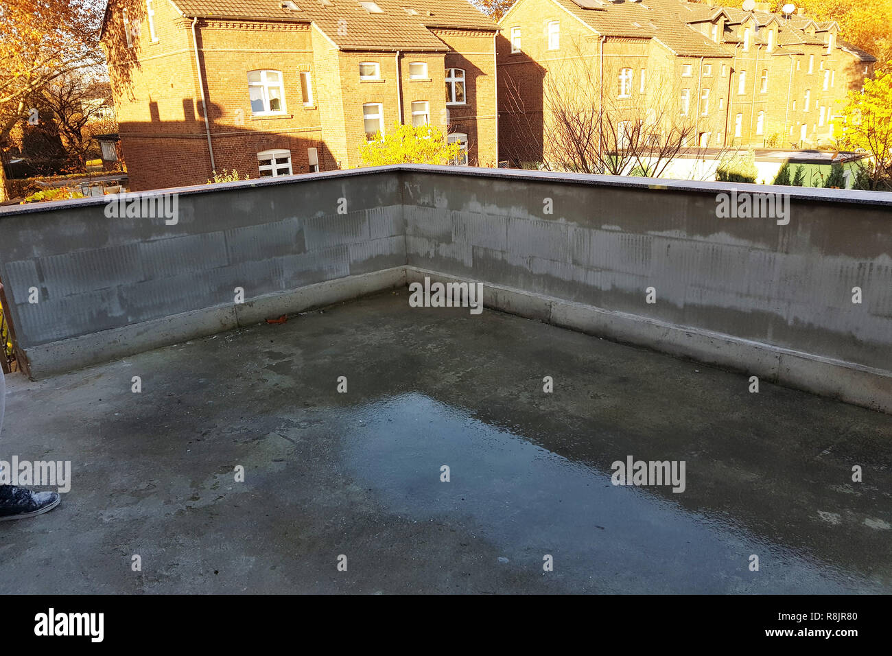 Renovated balcony with new concrete floor and brick balcony railing ...