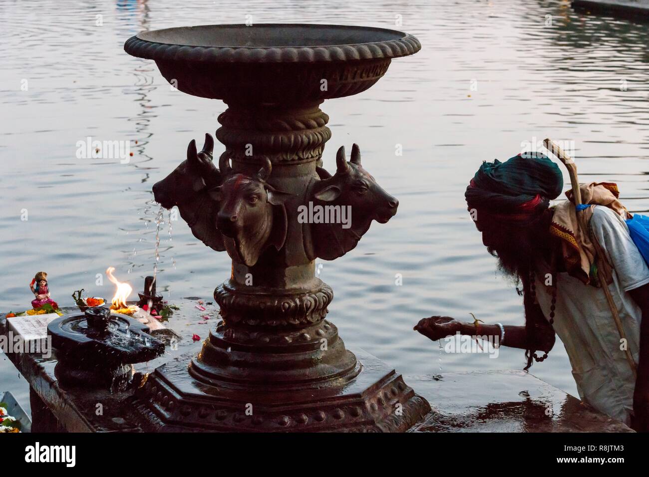 Collecting holy water from river hi-res stock photography and images ...