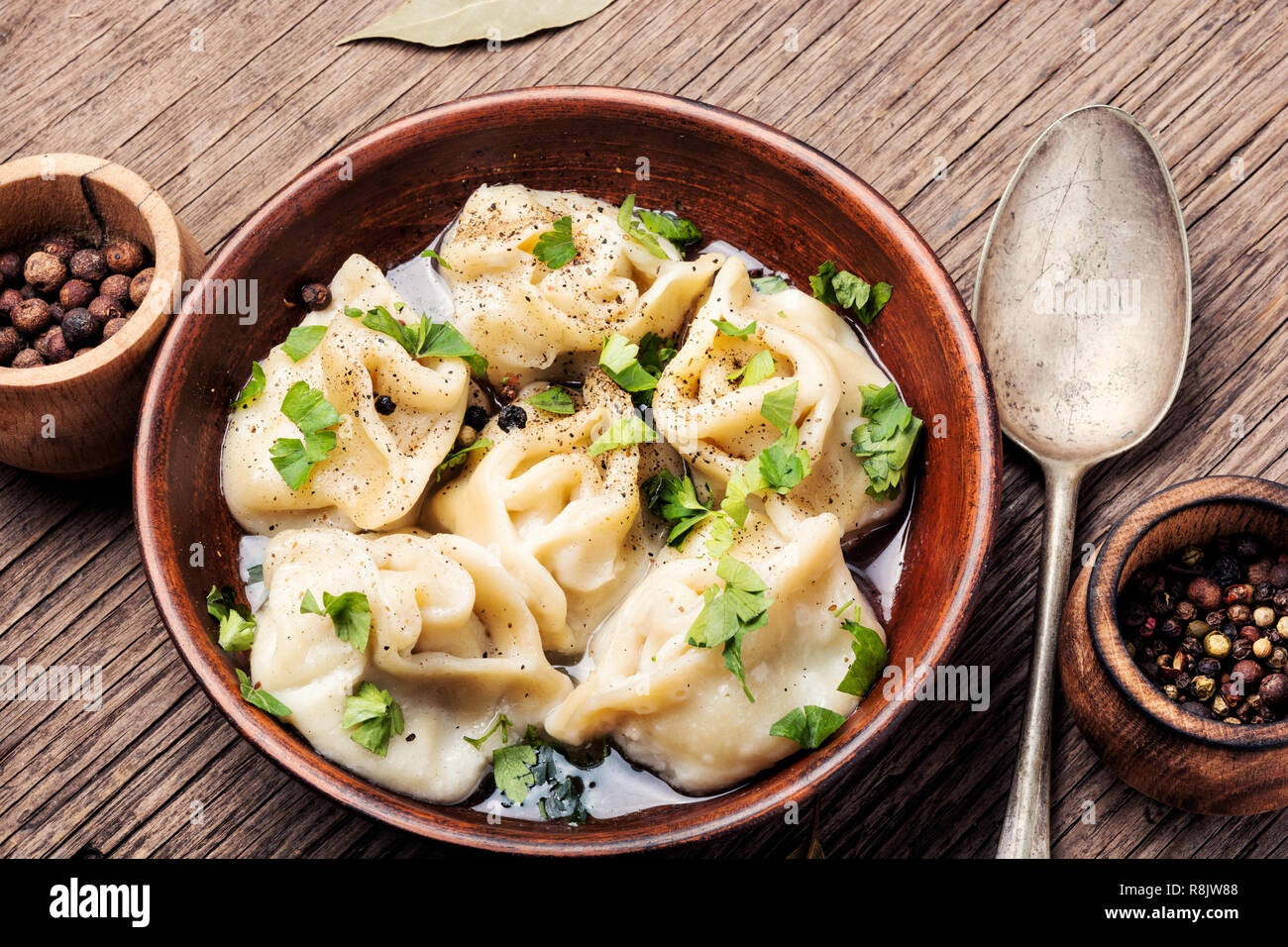 Traditional dish pelmeni.Meat dumplings on wooden rustic background ...