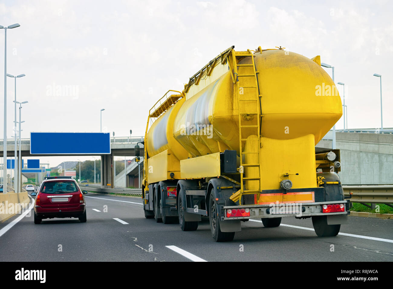 Yellow Tanker storage truck on the asphalt highway, Poland. Business ...