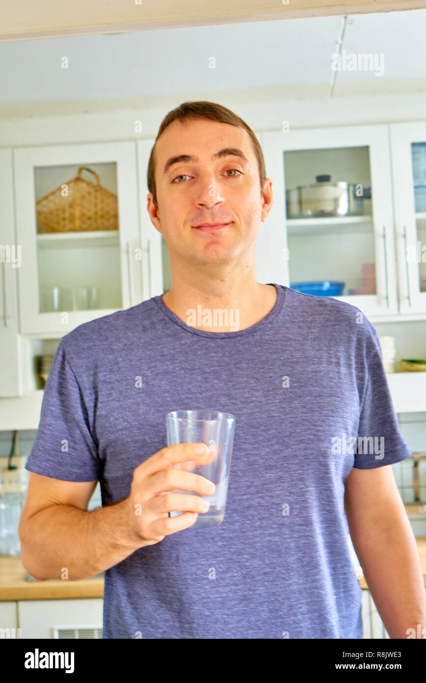 Handsome guy posing - drinking water Stock Photo - Alamy
