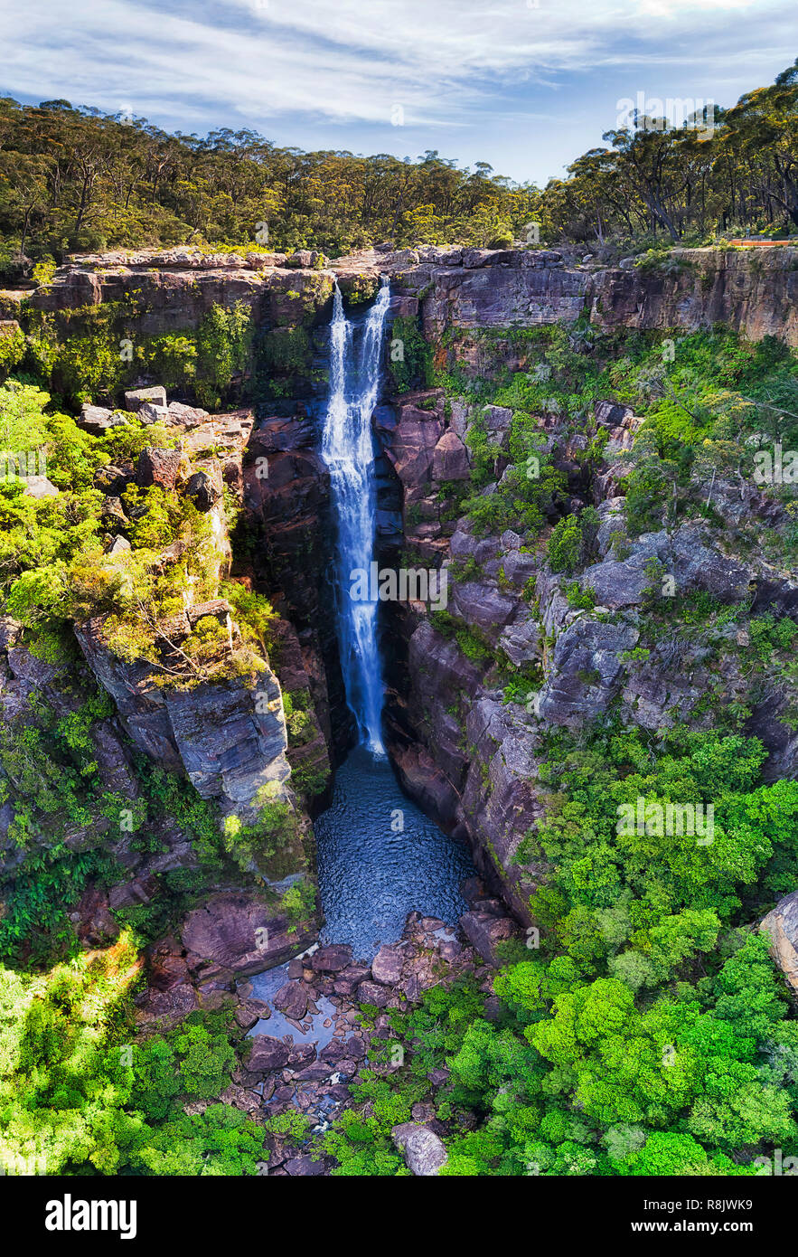 Tall waterfall of Kangaroo Valley from rocky plateau down to Kangaroo ...