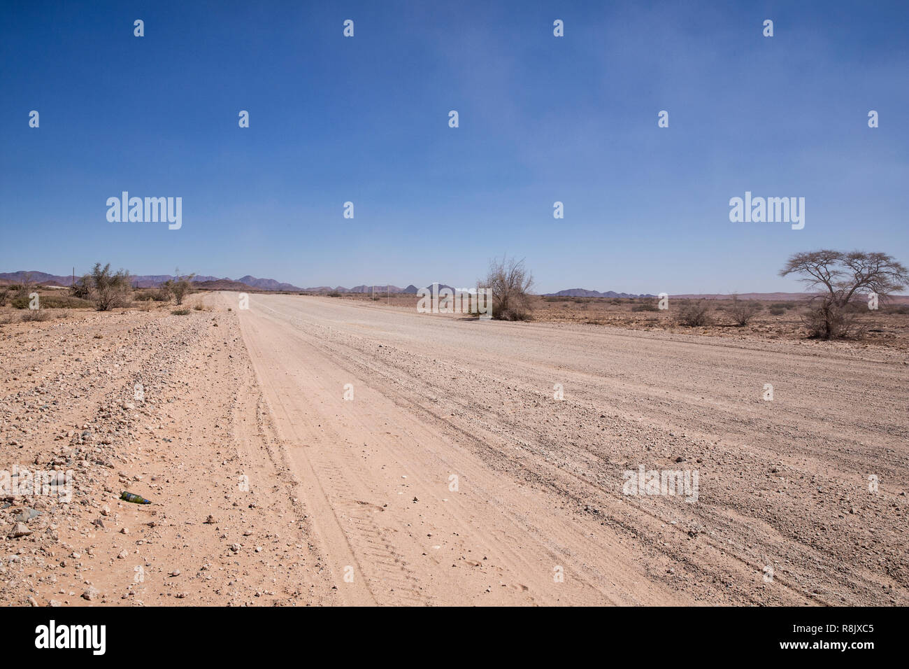 Gravel road through desert in Namibia Stock Photo - Alamy