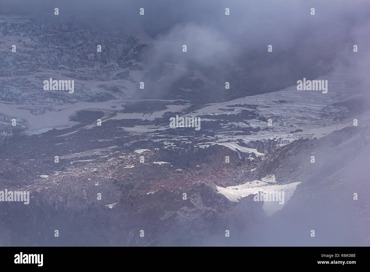 hazy view through mist and cloud of harsh stone mountainside Stock ...