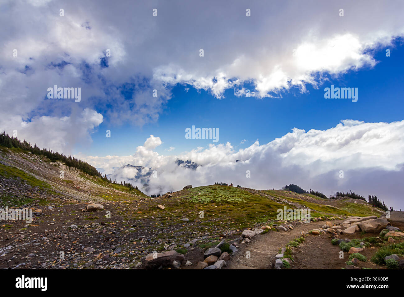 distant mountain range clouds and blue skys from rocky lookout Stock ...