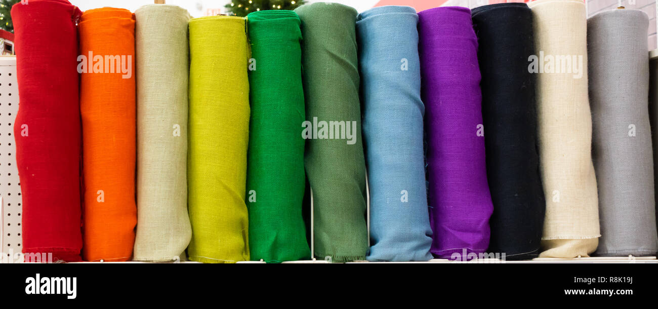 bundles of colorful cloth on display in shop Stock Photo - Alamy