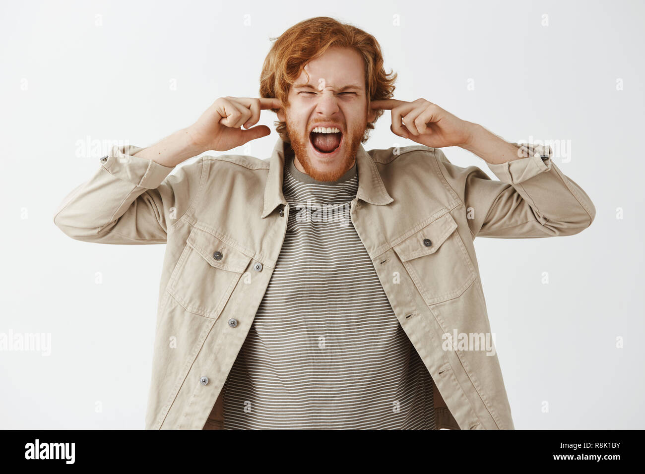 Man fed up of tv propaganda. Fed up and disstressed pissed redhead guy ...