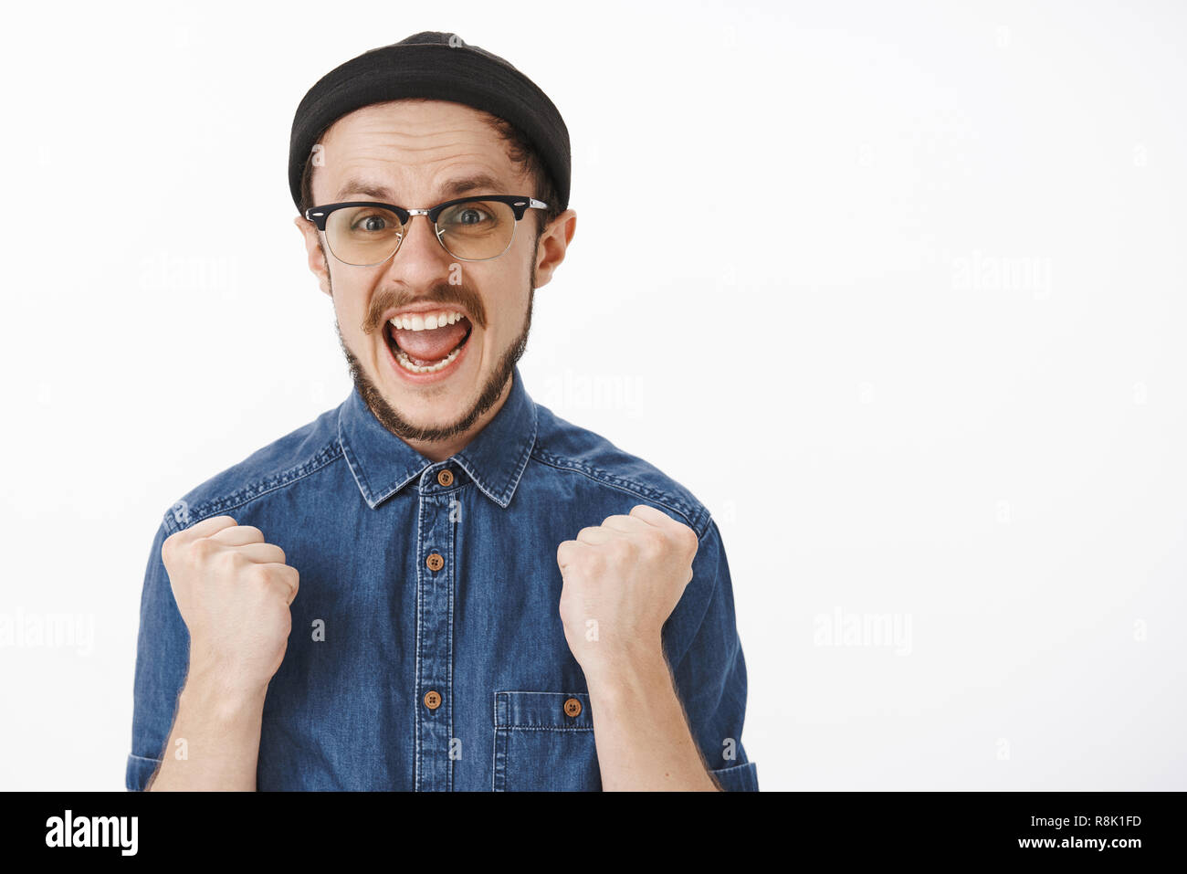 Standing smiling winning hat success hi-res stock photography and ...