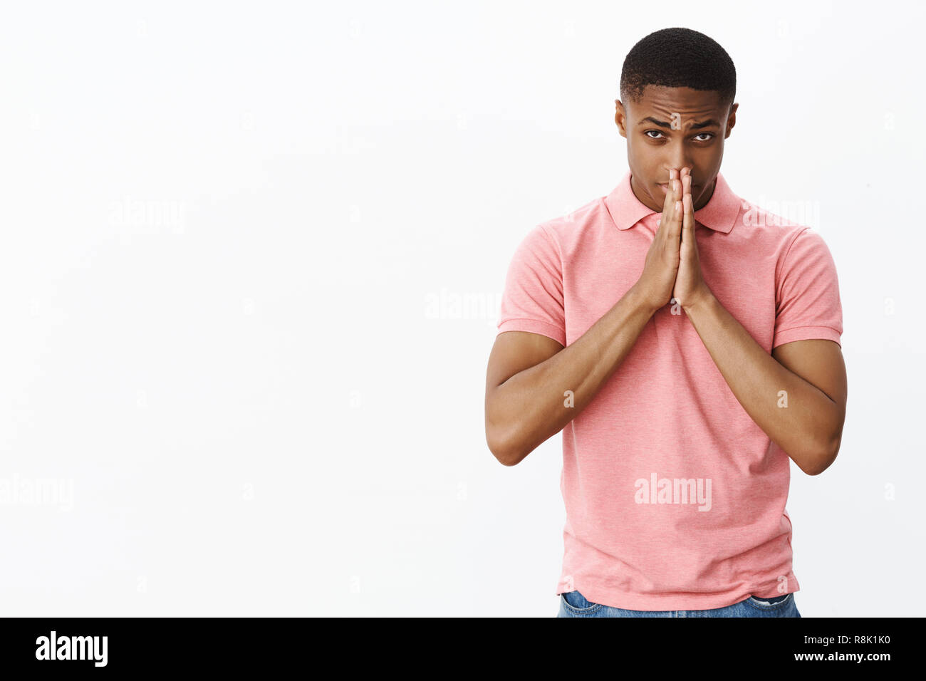 Cute and charismatic african american guy in pink polo shirt bowing ...