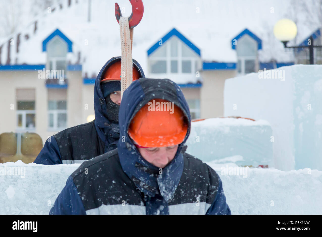 Portrait of a worker at the construction of the ice town for Christmas ...