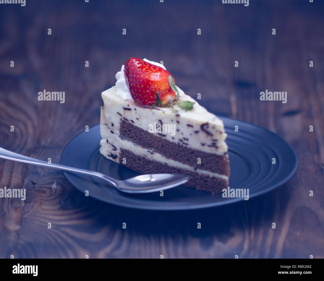 Chocolate and cheese cake on distressed wood background Stock Photo - Alamy