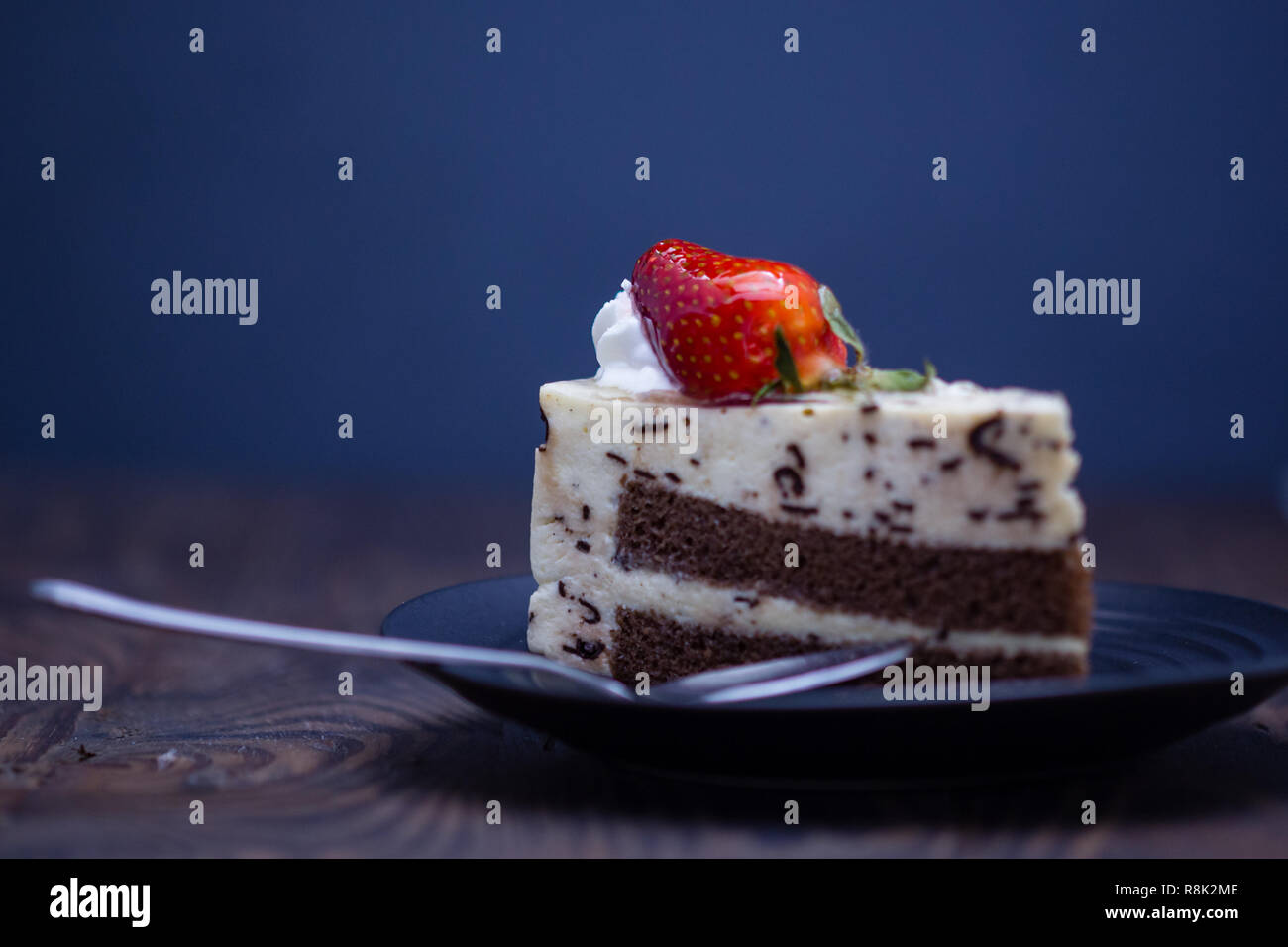 Chocolate and cheese cake on distressed wood background Stock Photo - Alamy