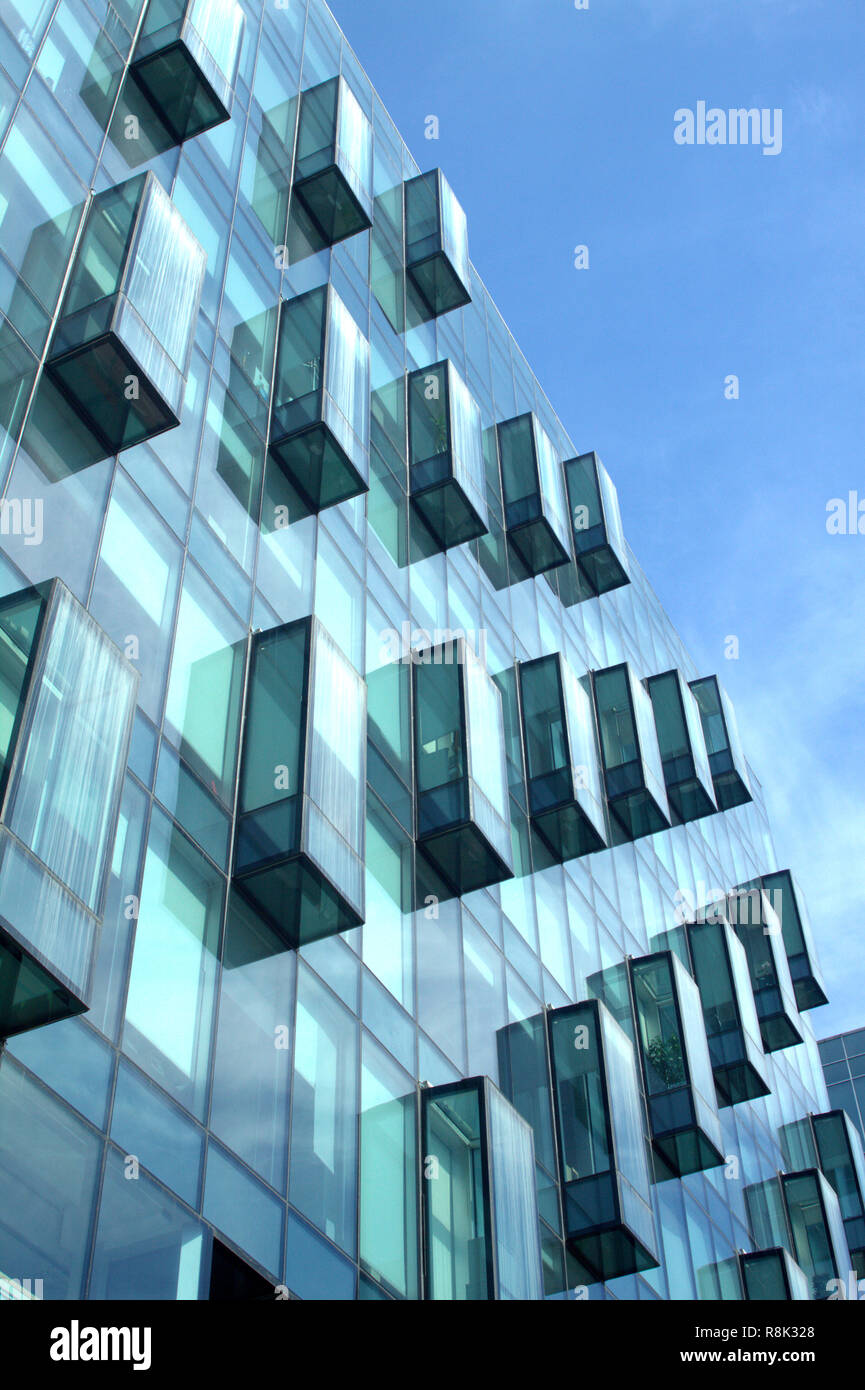 Glass wall of modern office building with many large panoramic windows ...