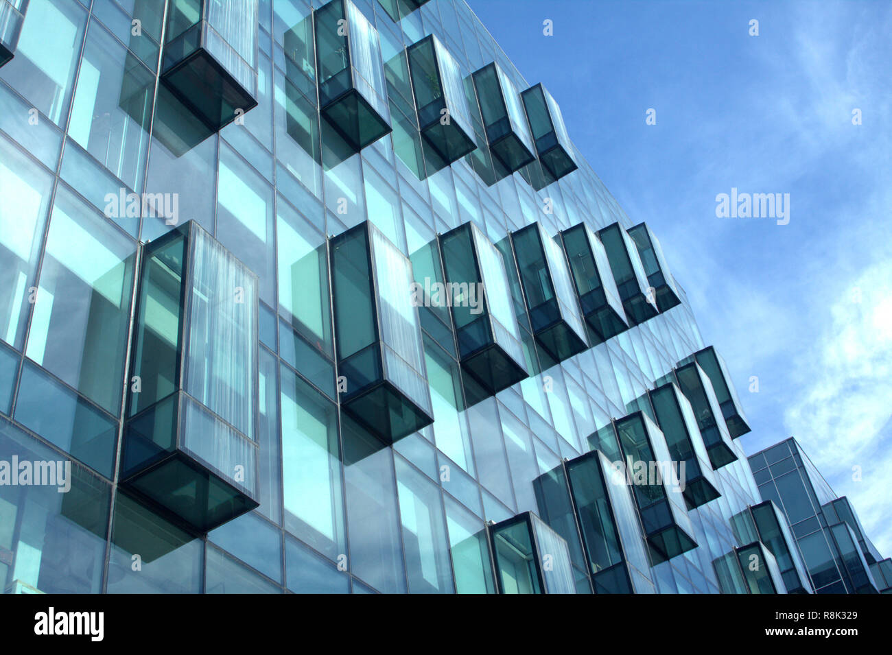 Glass wall of modern office building with many large panoramic windows ...