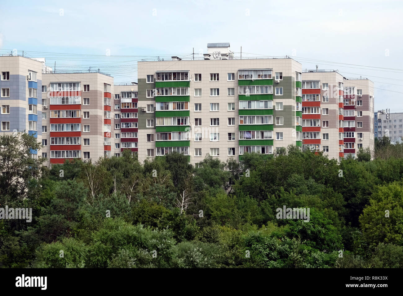Dense urban development of apartment buildings in the green area of the ...