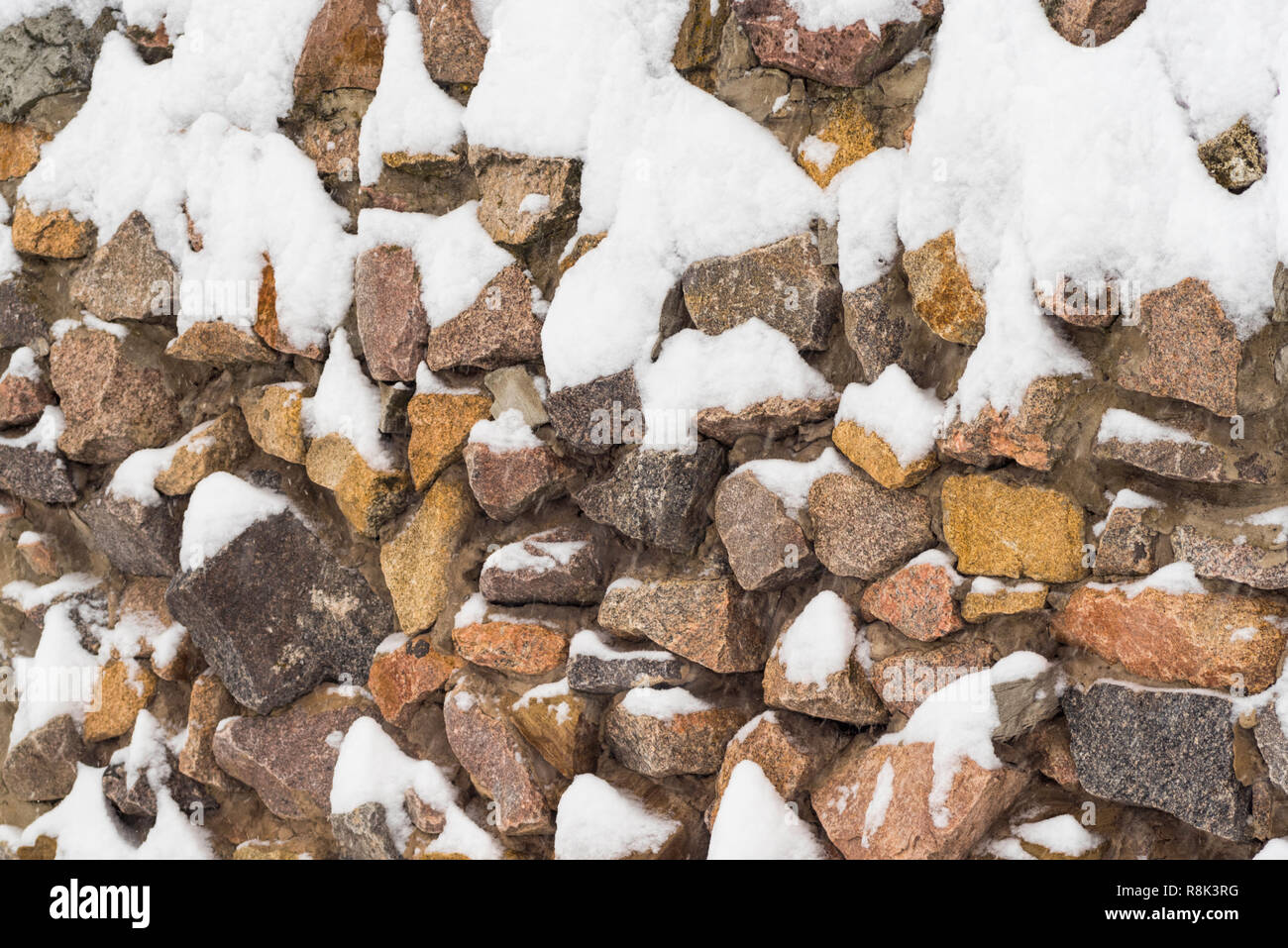 Winter landscape. A natural stone fence covered with snow Stock Photo ...