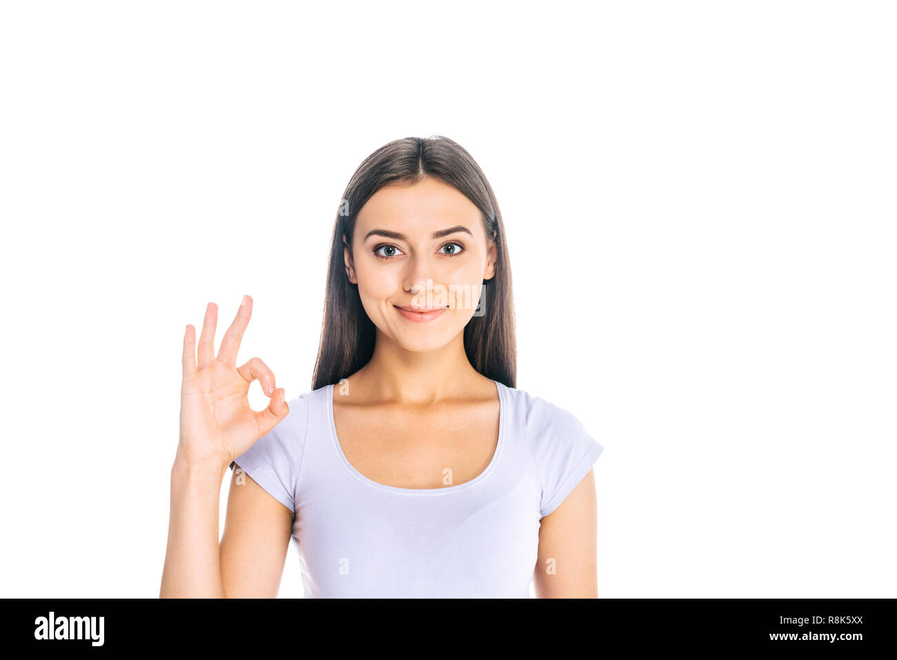 portrait of beautiful woman showing ok sign isolated on white Stock ...