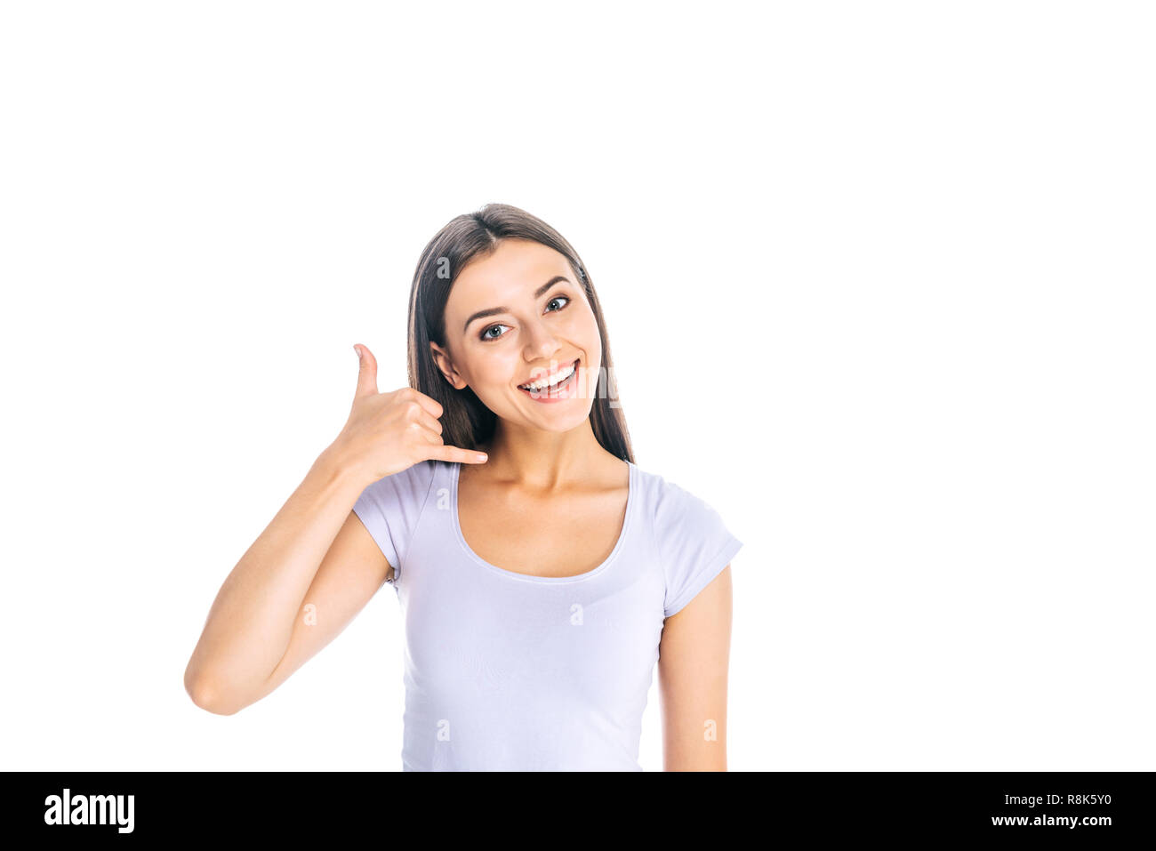 portrait of smiling woman showing call sign isolated on white Stock ...