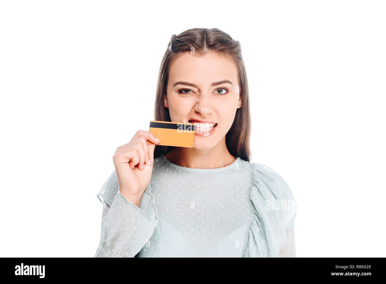 portrait of woman biting credit card isolated on white Stock Photo - Alamy
