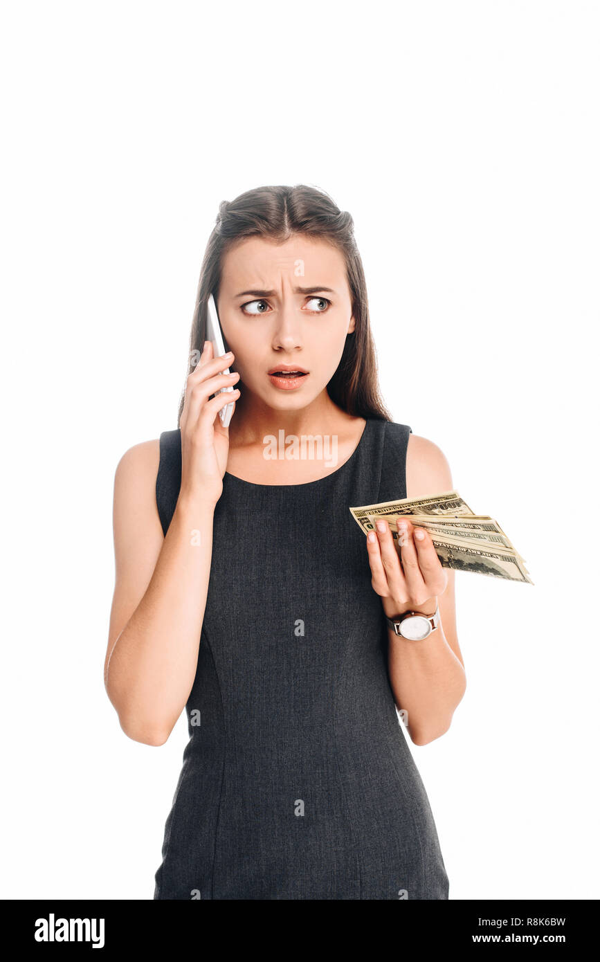 portrait of emotional businesswoman with dollar banknotes talking on ...