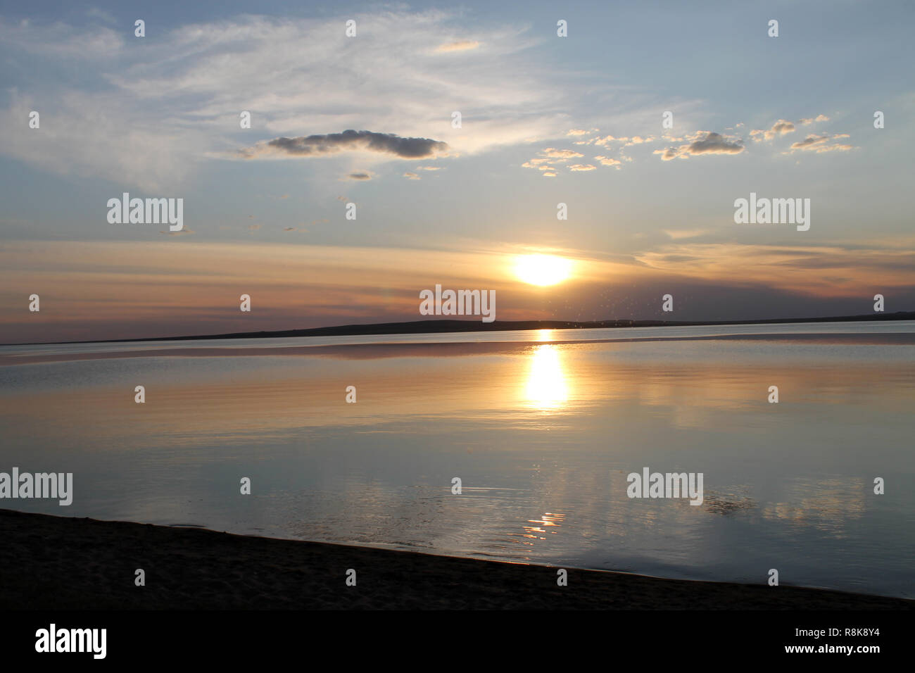 the setting sun reflected in the pond, lake, water, transparent Stock ...