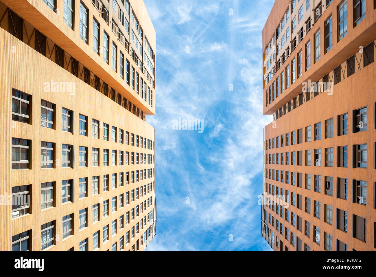Vertical buildings of houses with blue sky background photographed from ...